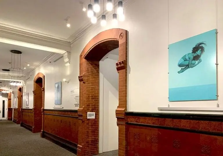 Hanging Posters with Cable Systems on Wall Tracks | Nova Display