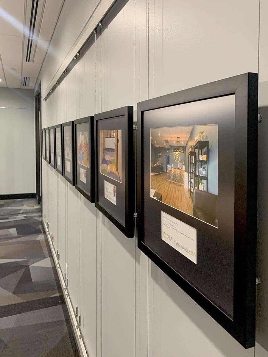 Framed Display with Rail-Track Tensioned Suspended Cables