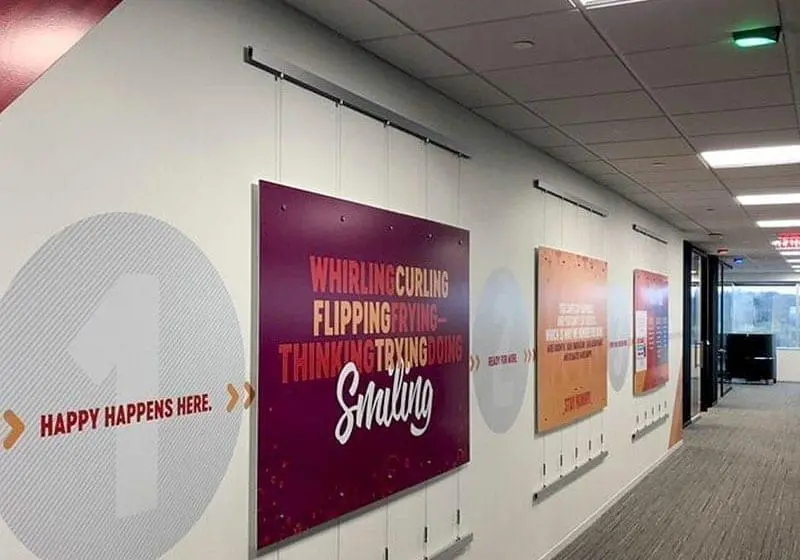 Hanging Posters with Cable Systems on Wall Tracks | Nova Display